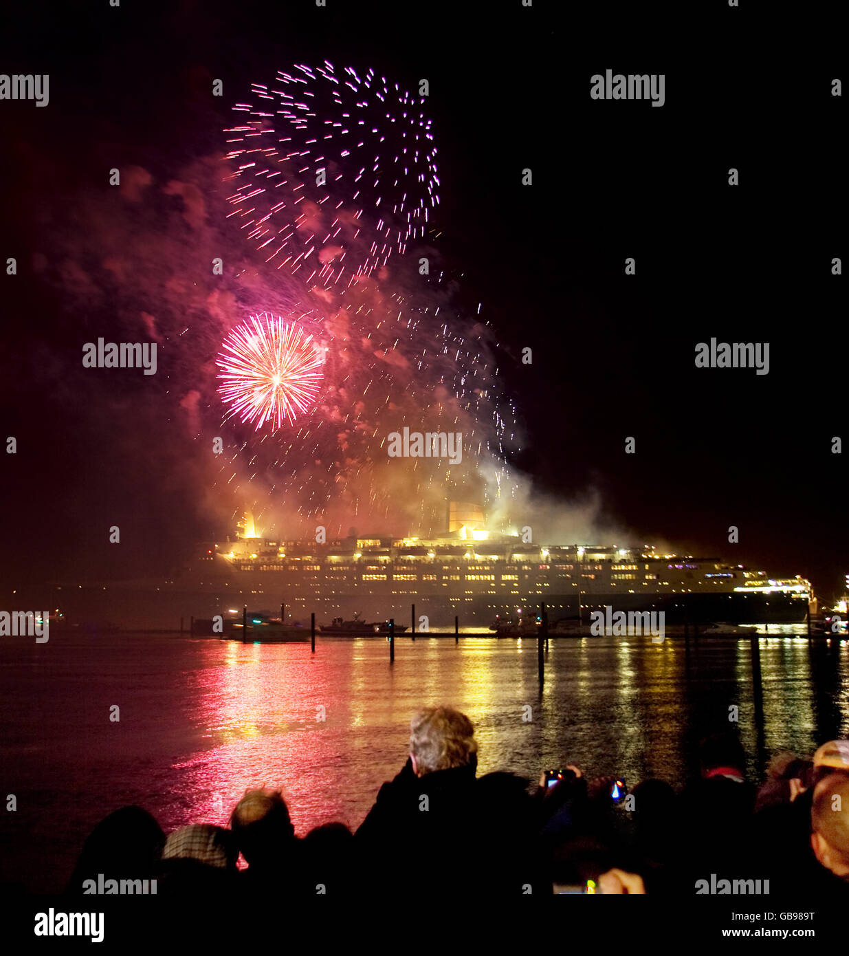 Fireworks explode in the sky as the the 70,000-tonne Cunard liner, the ...