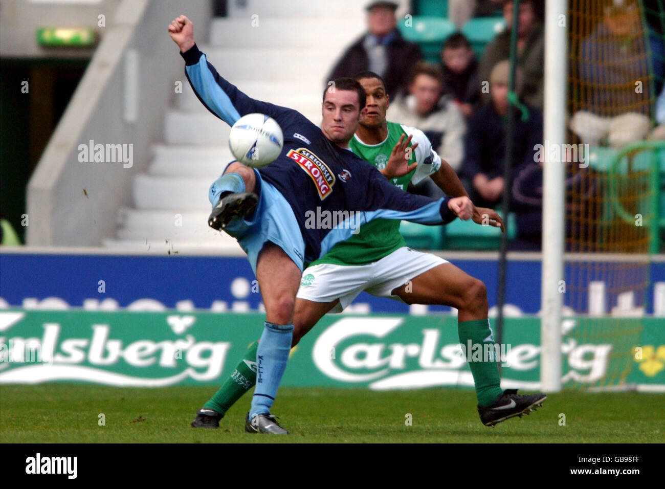 Kilmarnock's Kris Boyd (front) shields the ball from Hibernian's ...