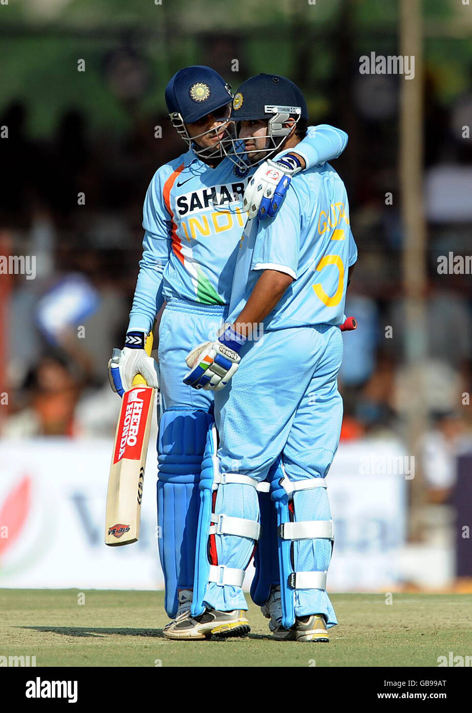 India's Virender Sehwag and Gautam Gambhir celebrate their 100 partnership during The First One ...