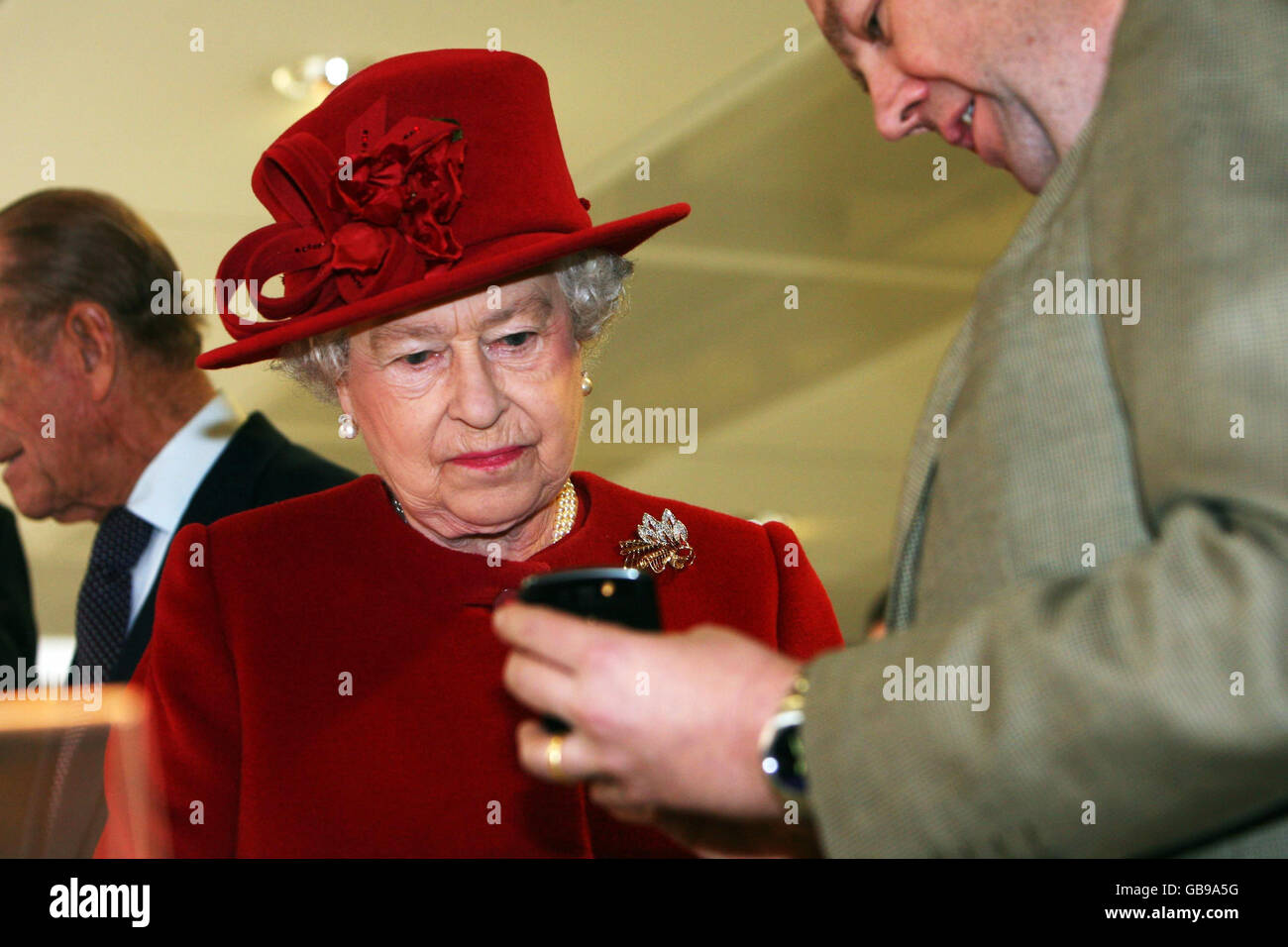 Queen Elizabeth II and the Duke of Edinburgh (far left) visit the ...