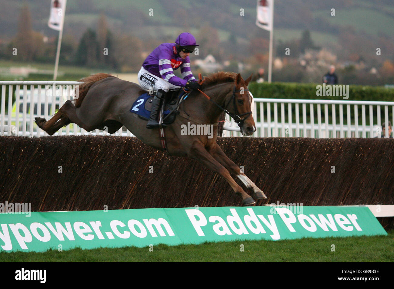 Horse racing races full length fence jumps jockey hi-res stock ...