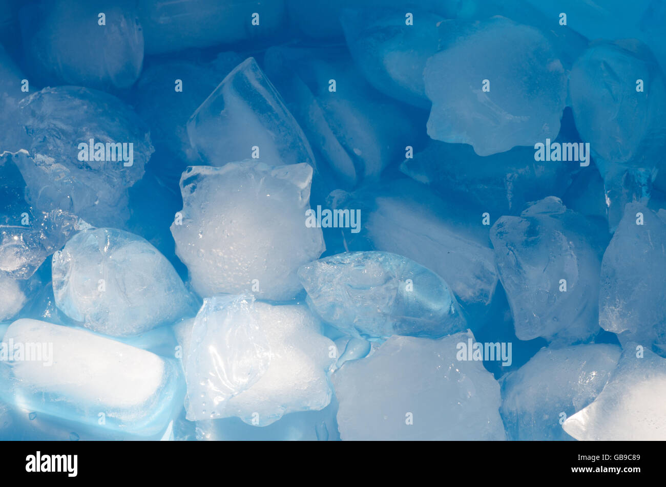ice cubes on blue background Stock Photo - Alamy