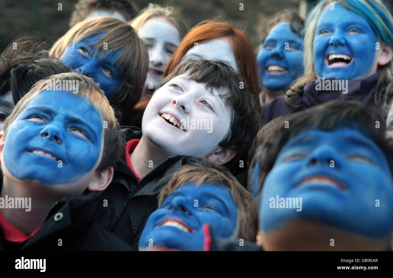 Edinburgh Schoolchildren with painted faces try to make the shape of a ...