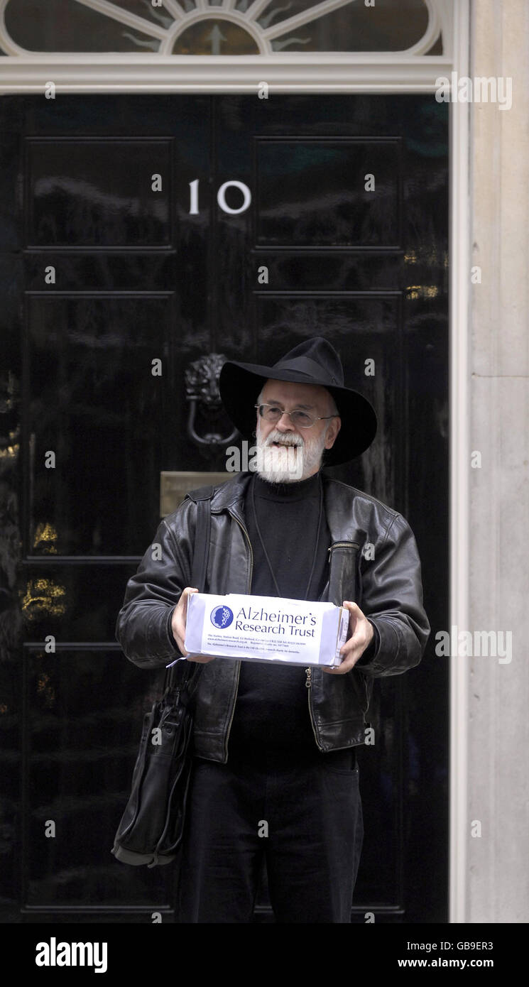 Novelist Terry Pratchett hands a petition in at 10 Downing Street ...