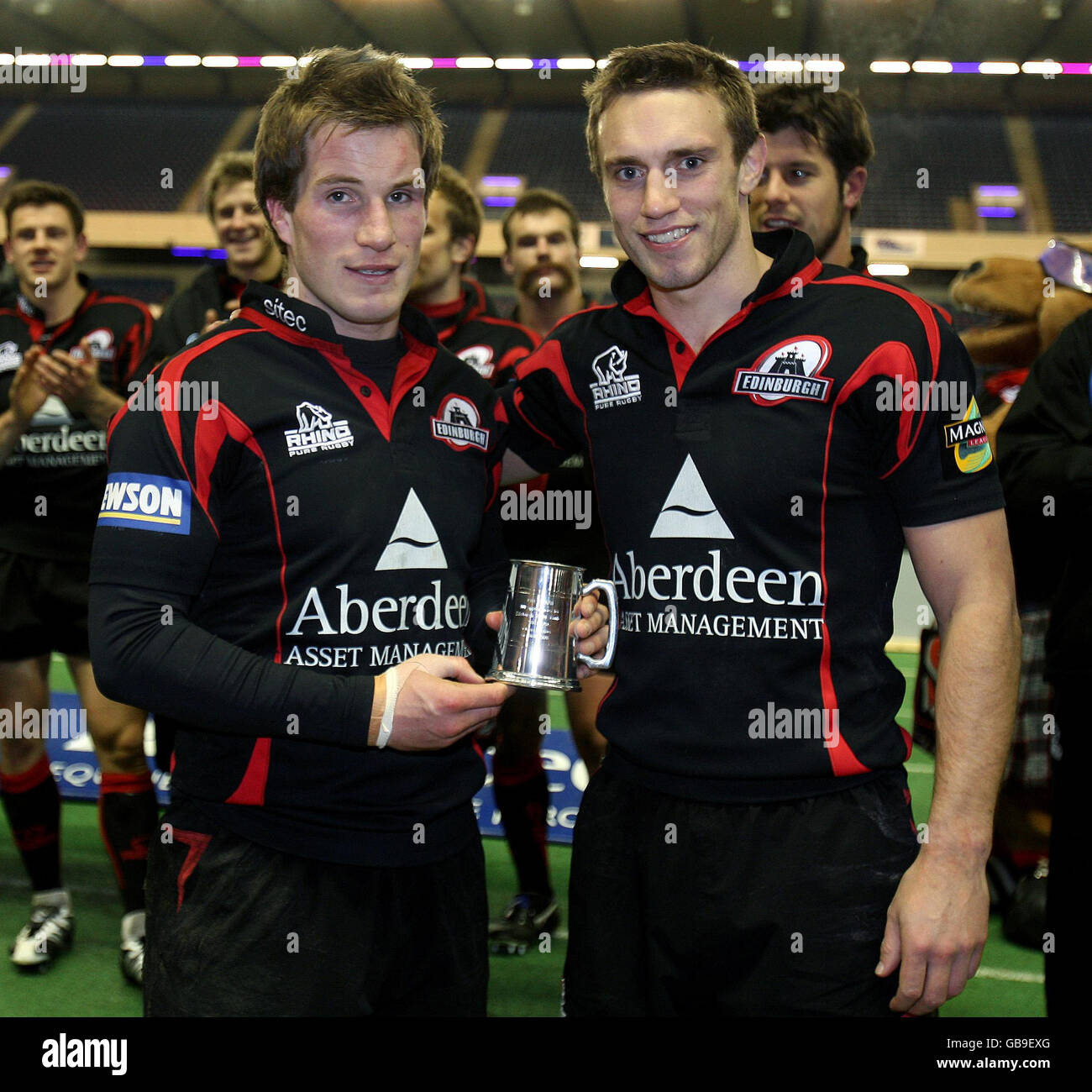 Edinburgh's Phil Godman is presented an award from captain Mike Blair ...