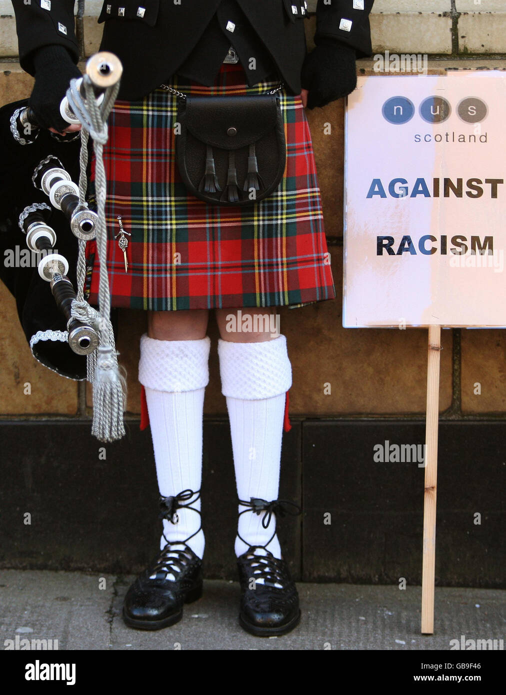 Glasgow anti-racism march. A piper during a Scottish Trades Union ...