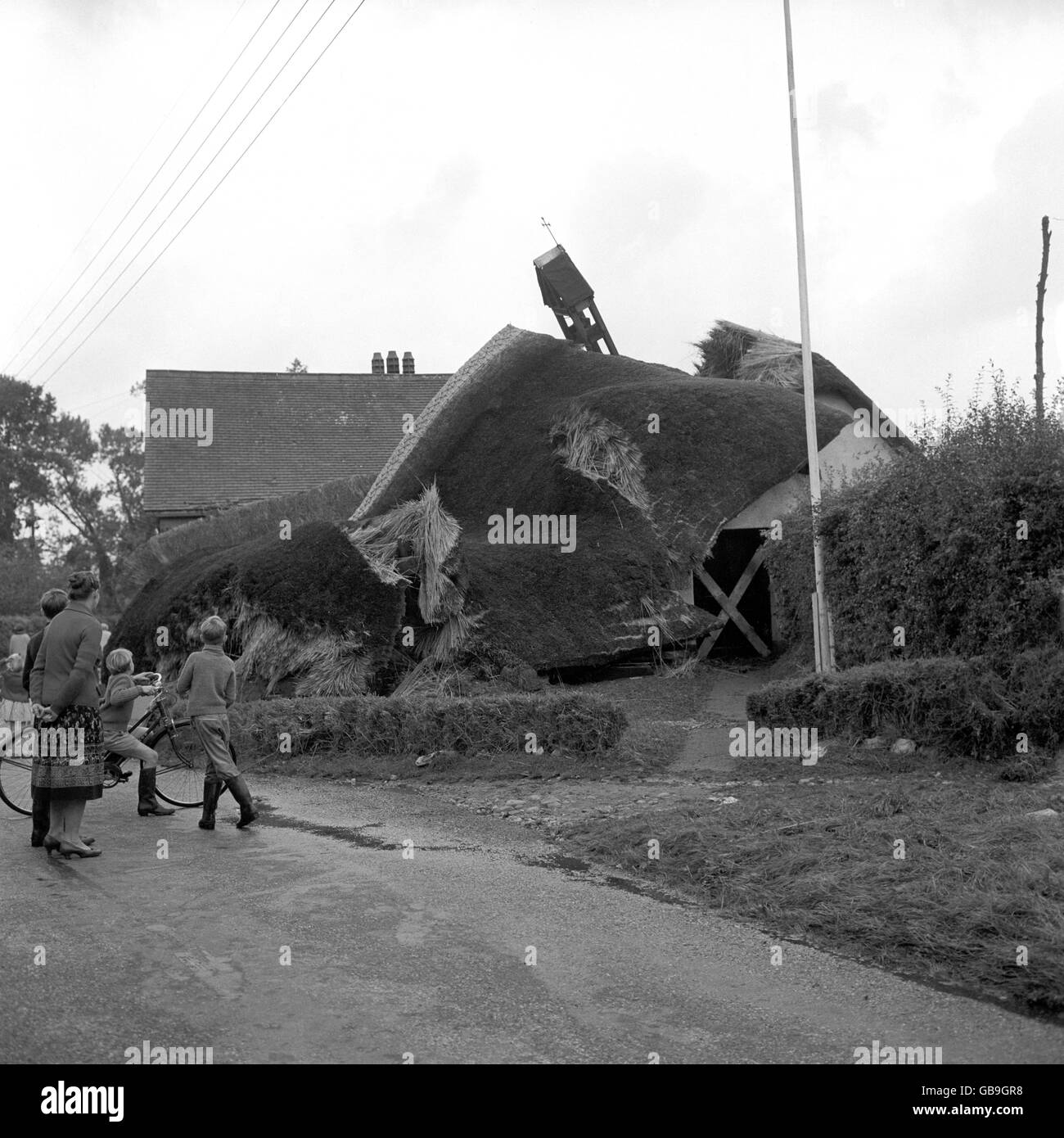A crumpled mass of thatch, that used to serve as a church at Exton ...