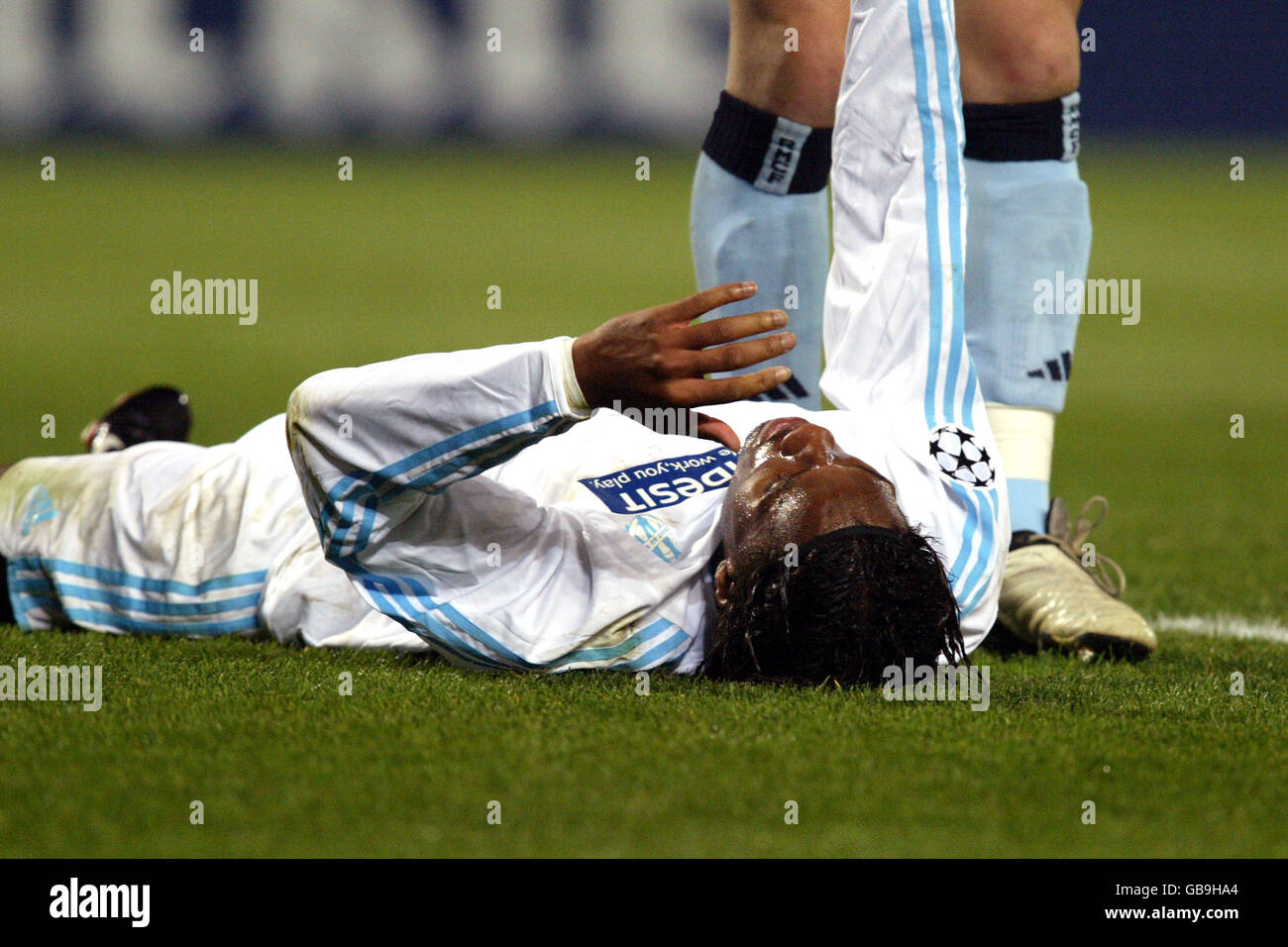 Olympique Marseille's Didier Drogba lies injured on the floor Stock ...