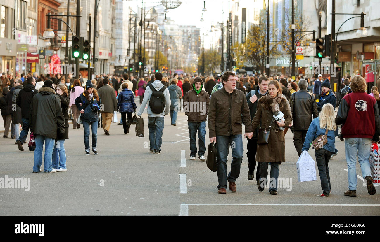A huge crowd of Christmas shoppers block the pavements and the road, as ...