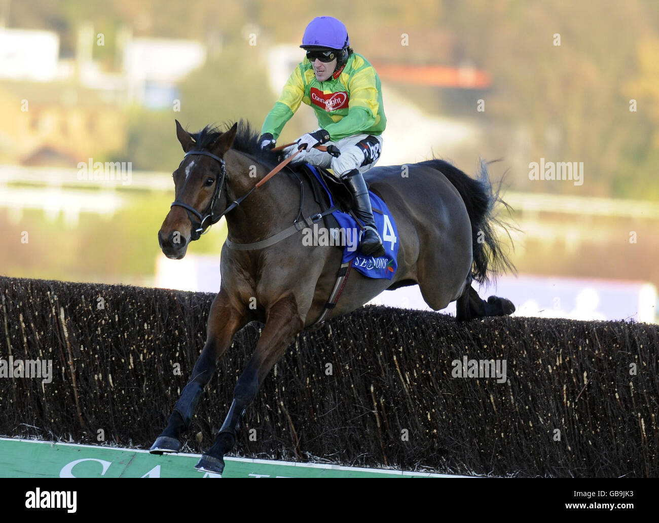 Master Minded and Tony McCoy jump the last fence before going on to win ...