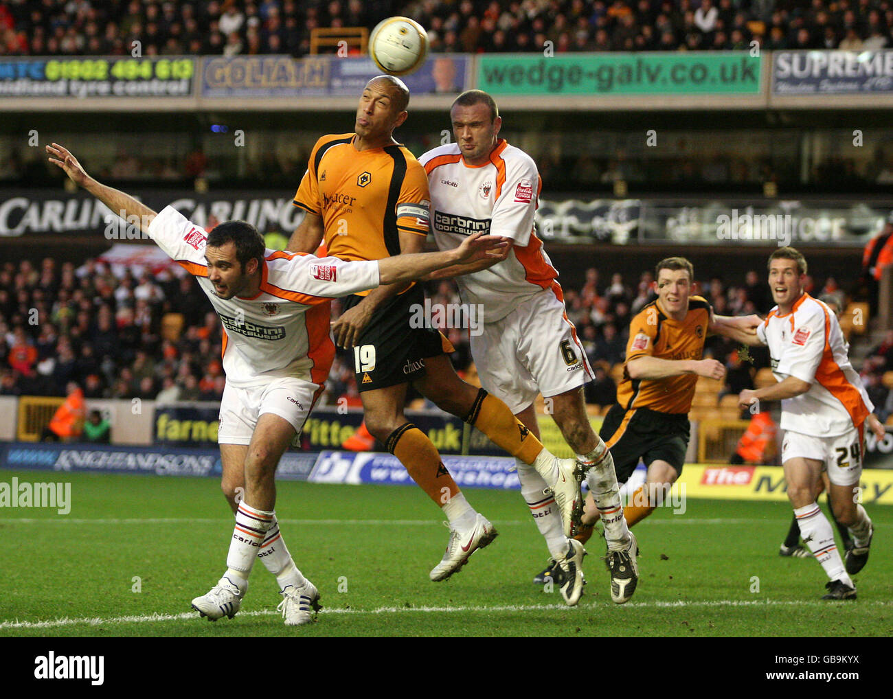 Wolves' Chris Iwelumo's (centre) competes with Blackpool's Gary Taylor ...