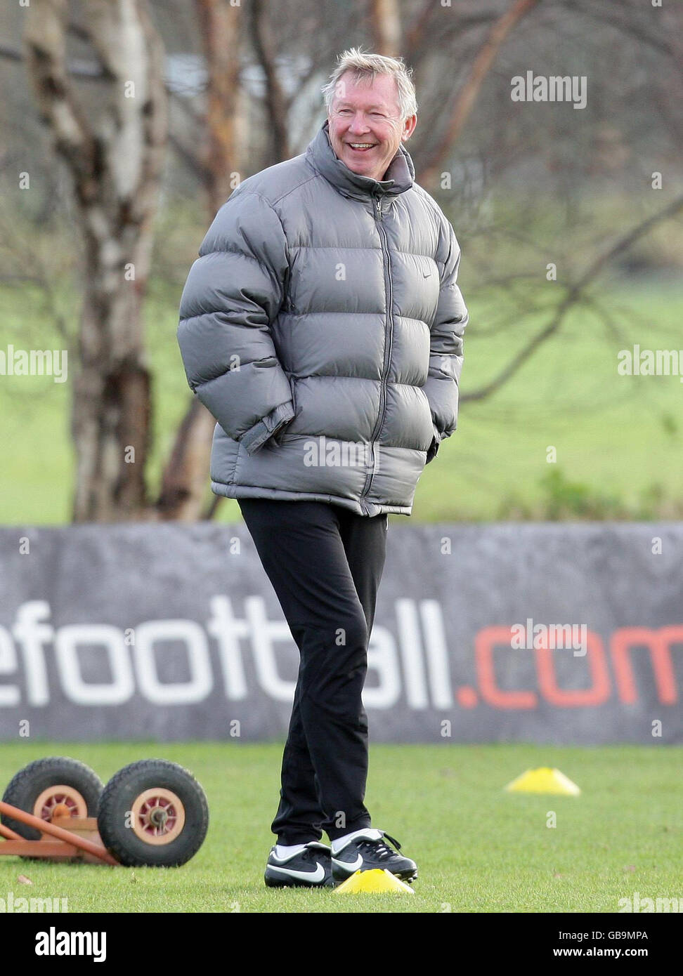 Manchester united manager sir alex ferguson watches over training hi ...