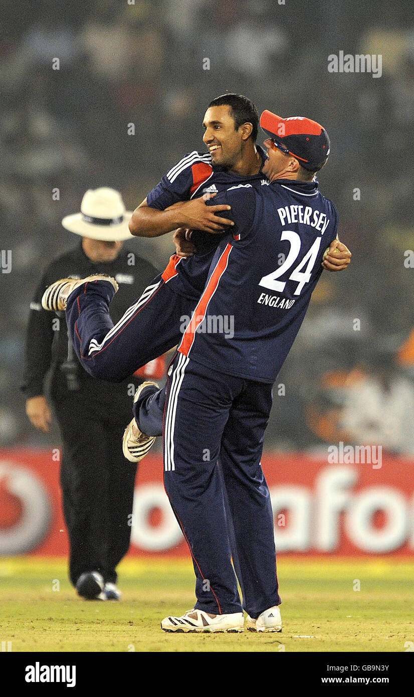 England's Samit Patel is congratulated by Kevin Pietersen after taking ...