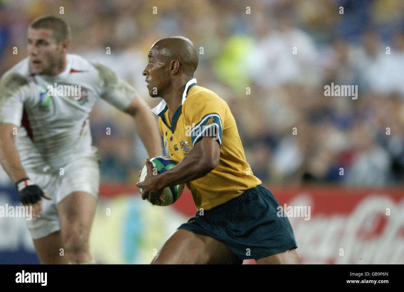 Australias captain george gregan runs with the ball hi-res stock ...