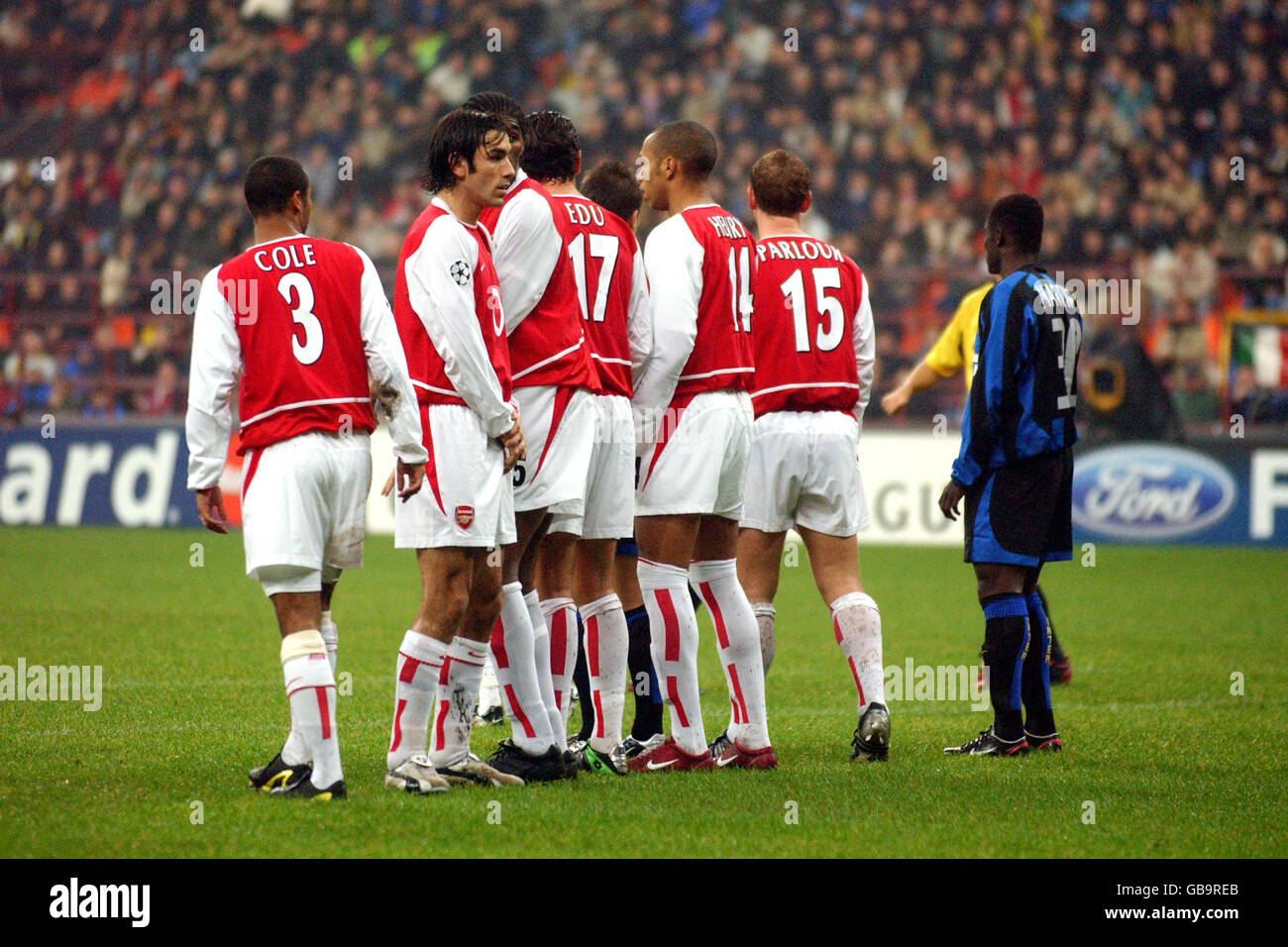 Thierry henry and ray parlour form a defensive wall hi-res stock ...