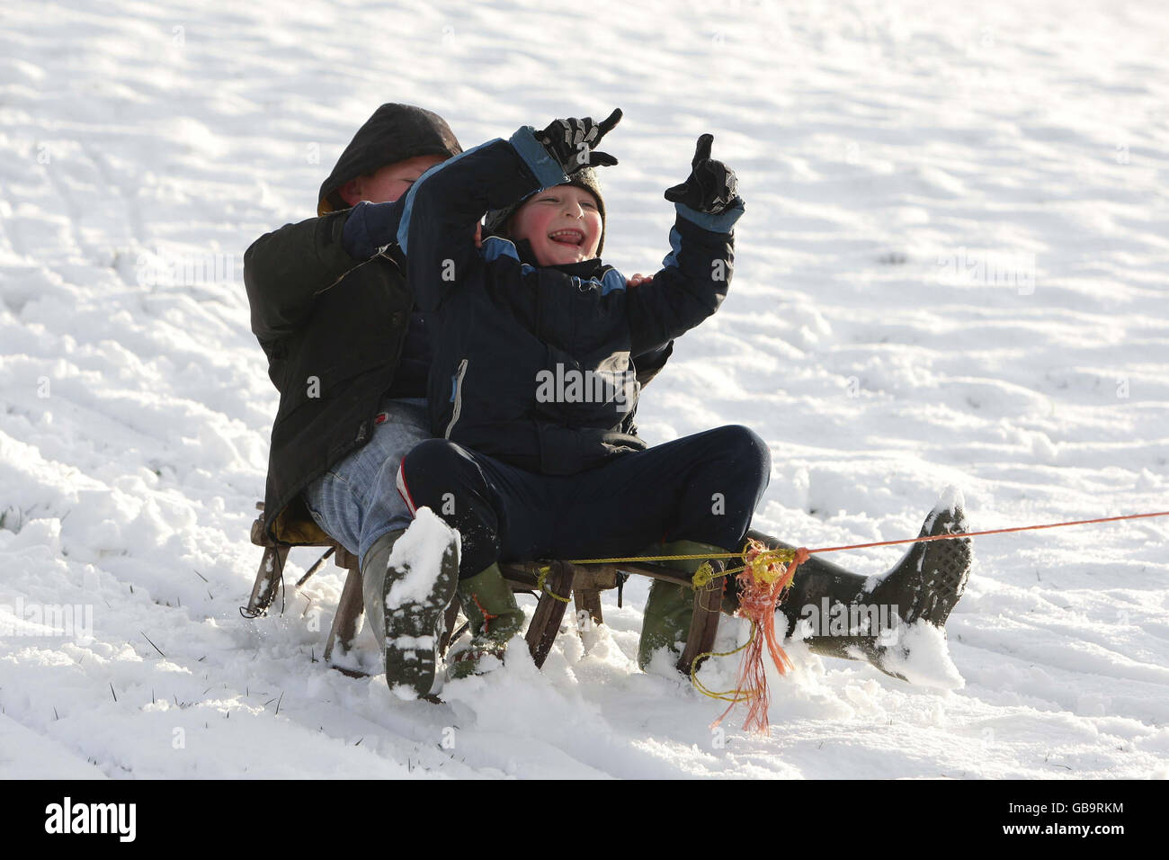 Children (names not given) play in a field covered in snow in ...