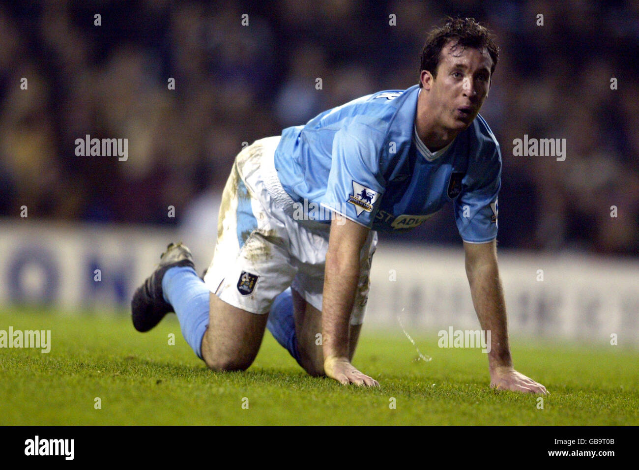 Manchester City's Robbie Fowler is on his knees after missing a chance ...