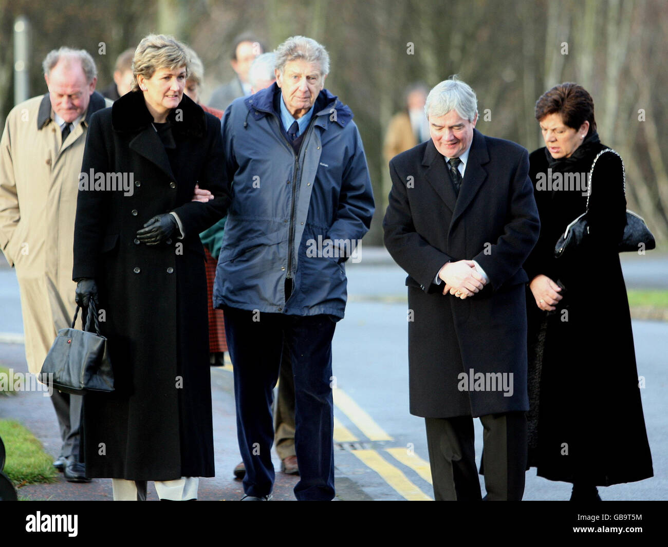 Jimmy Ellis (third right) and mourners at the funeral of John Hewitt at ...