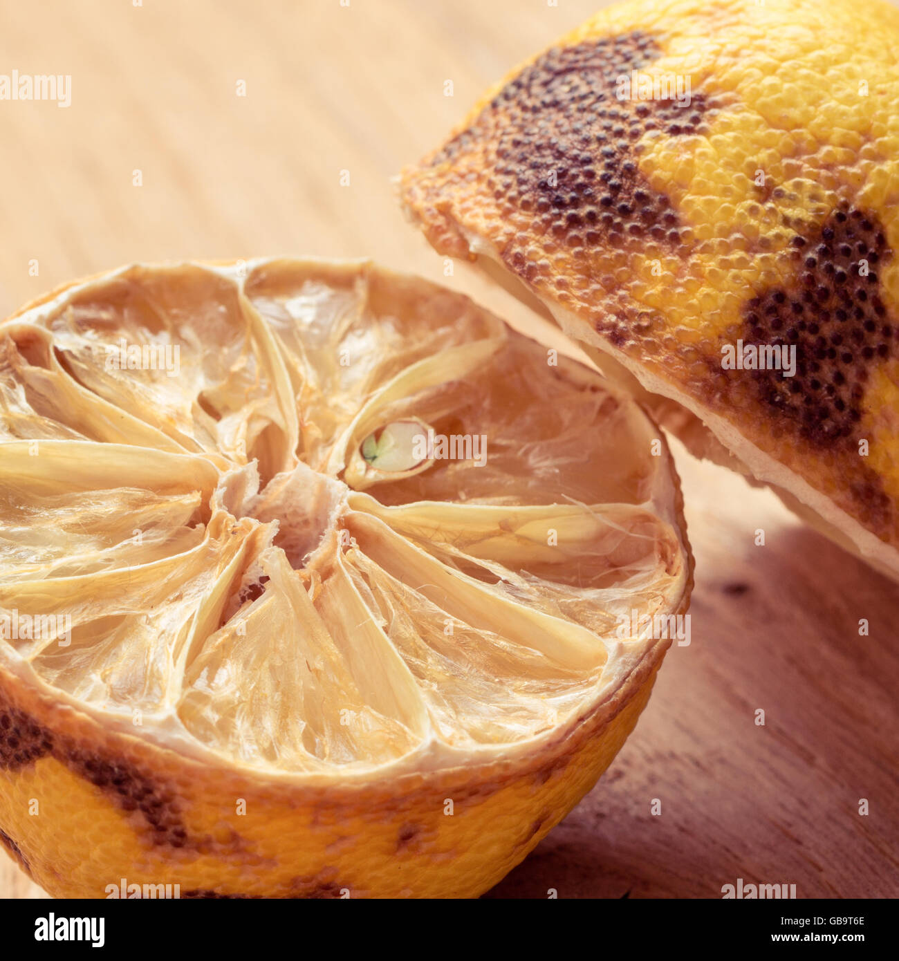 Closeup old rotten piece of lemon. Bad unhealthy food Stock Photo - Alamy