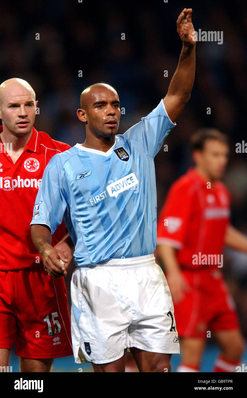 Manchester City's Trevor Sinclair is shadowed by Middlesbrough's Danny ...