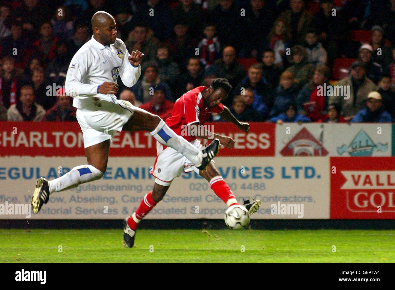 Leeds United's Michael Duberry (l) leaps to take the ball from Charlton ...