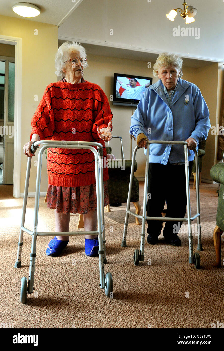 A couple of elderly residents at a North East London nursing home, use ...