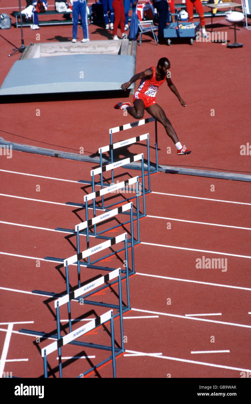 USA's Ed Moses clears a hurdle as he turns into the final straight a ...