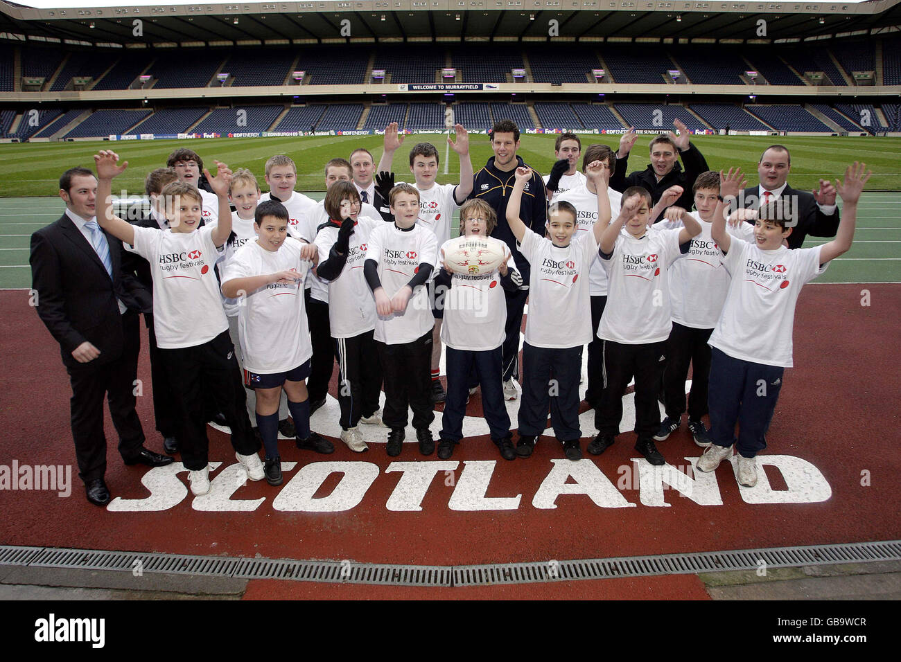 Scotland international Dave Callam (back, centre) poses with children ...