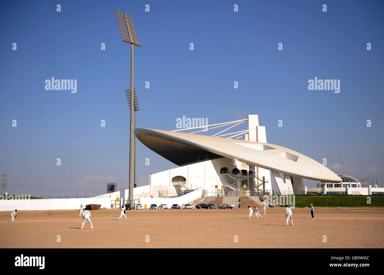 Local cricket teams play a match in the desert outside the Sheikh Zayed ...