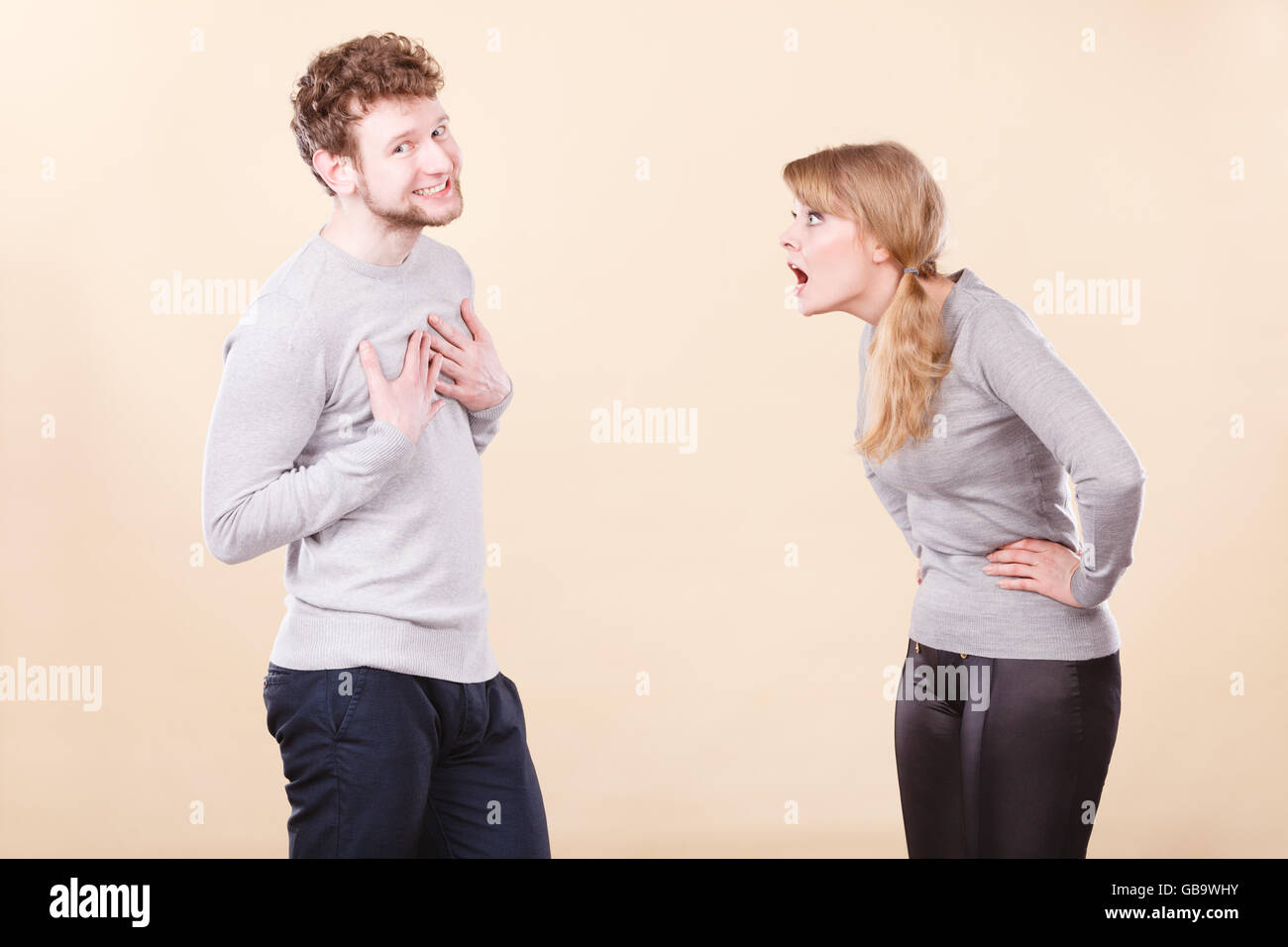 Problems in relationship. Young blonde couple arguing and yelling on ...