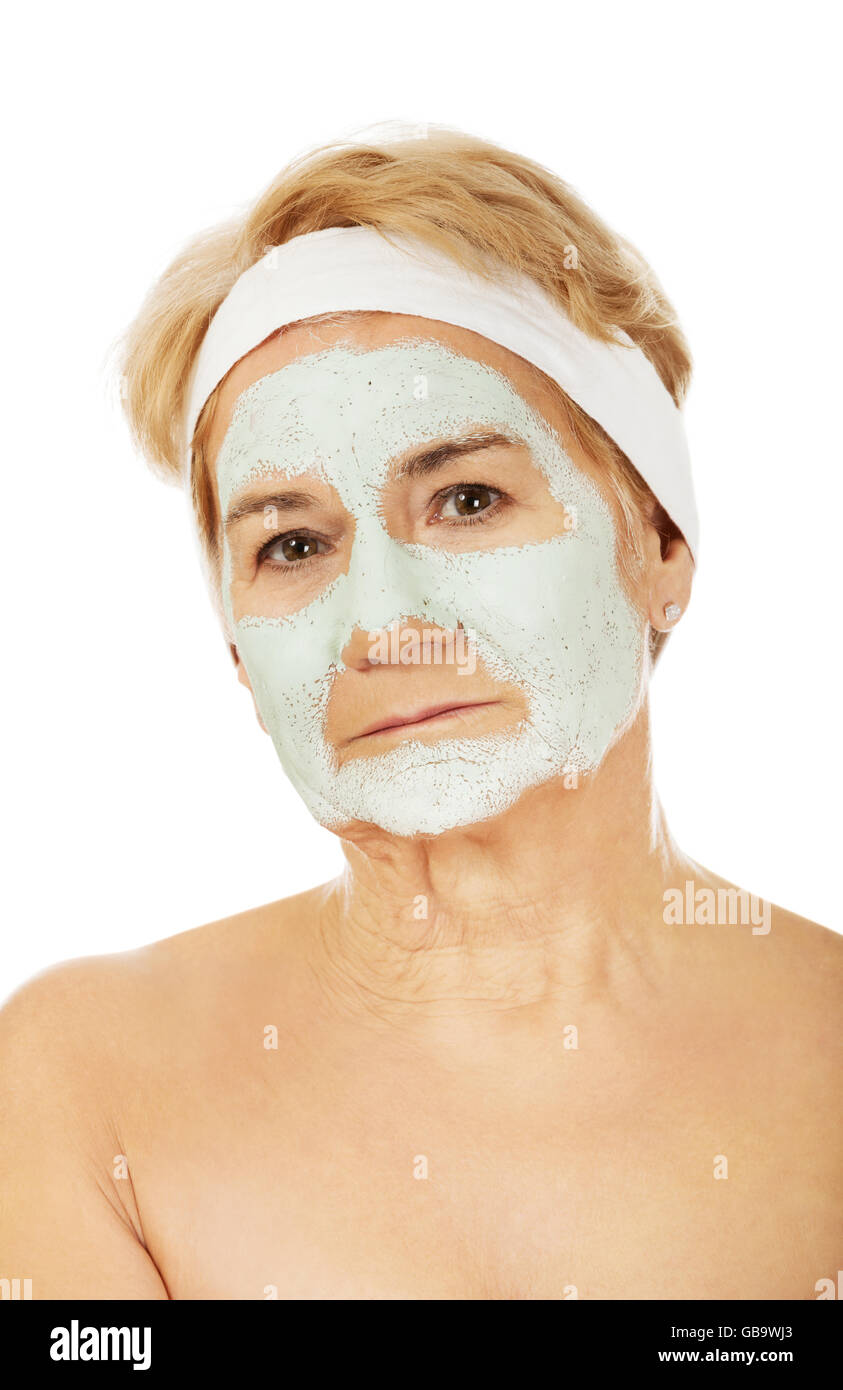 Relaxed elderly woman in facial mask Stock Photo - Alamy