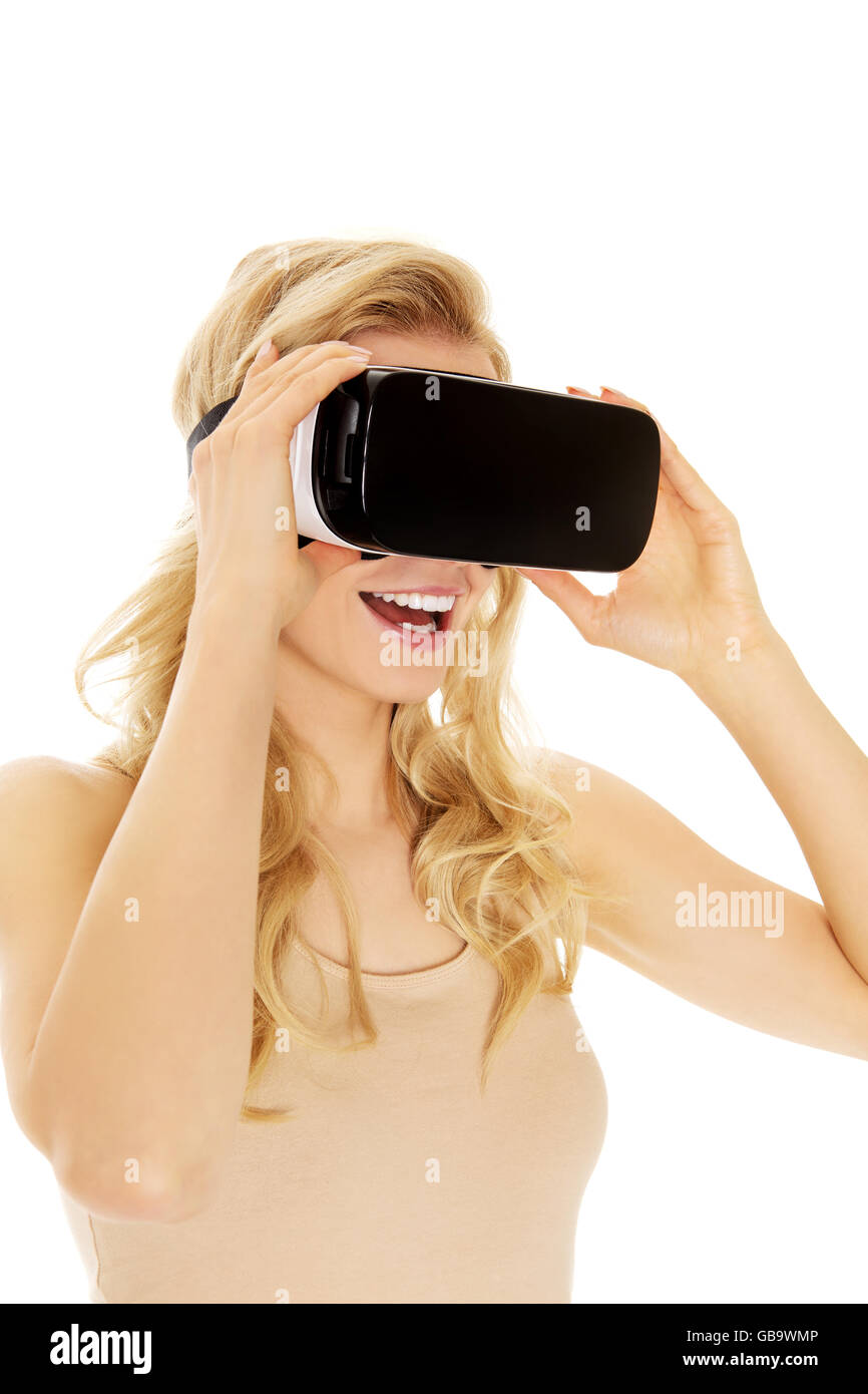 Happy woman wearing virtual reality goggles Stock Photo - Alamy