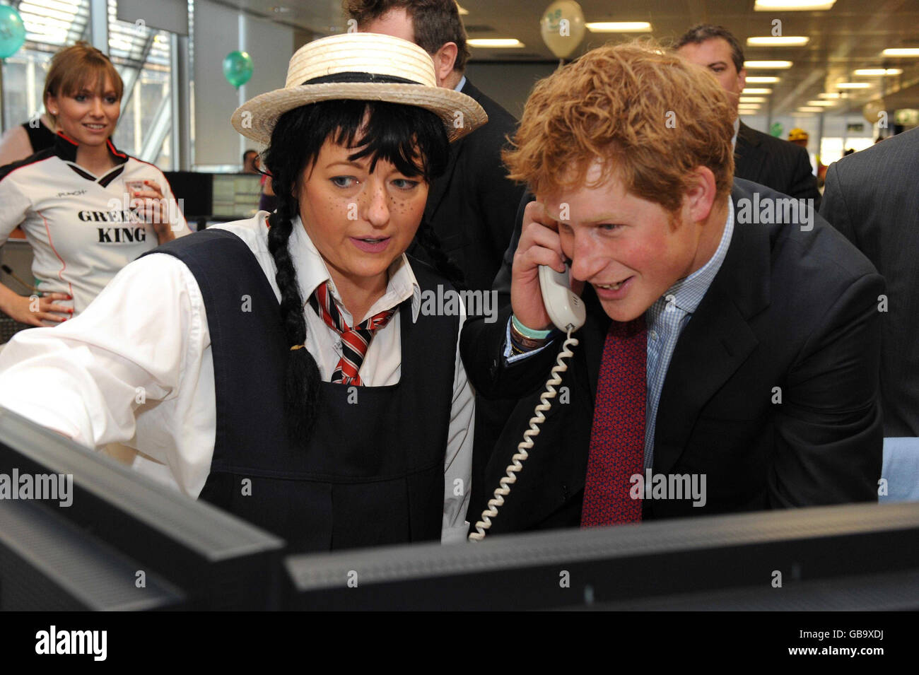 Prince Harry with broker Amanda Hartnell at the offices of city traders ...