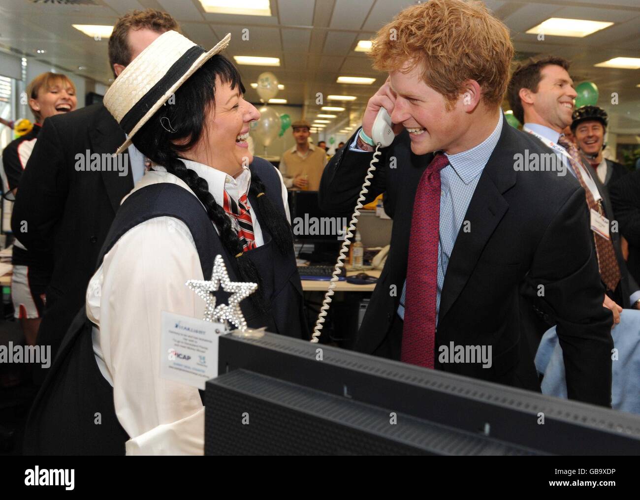 Prince Harry with broker Amanda Hartnell at the offices of city traders ...