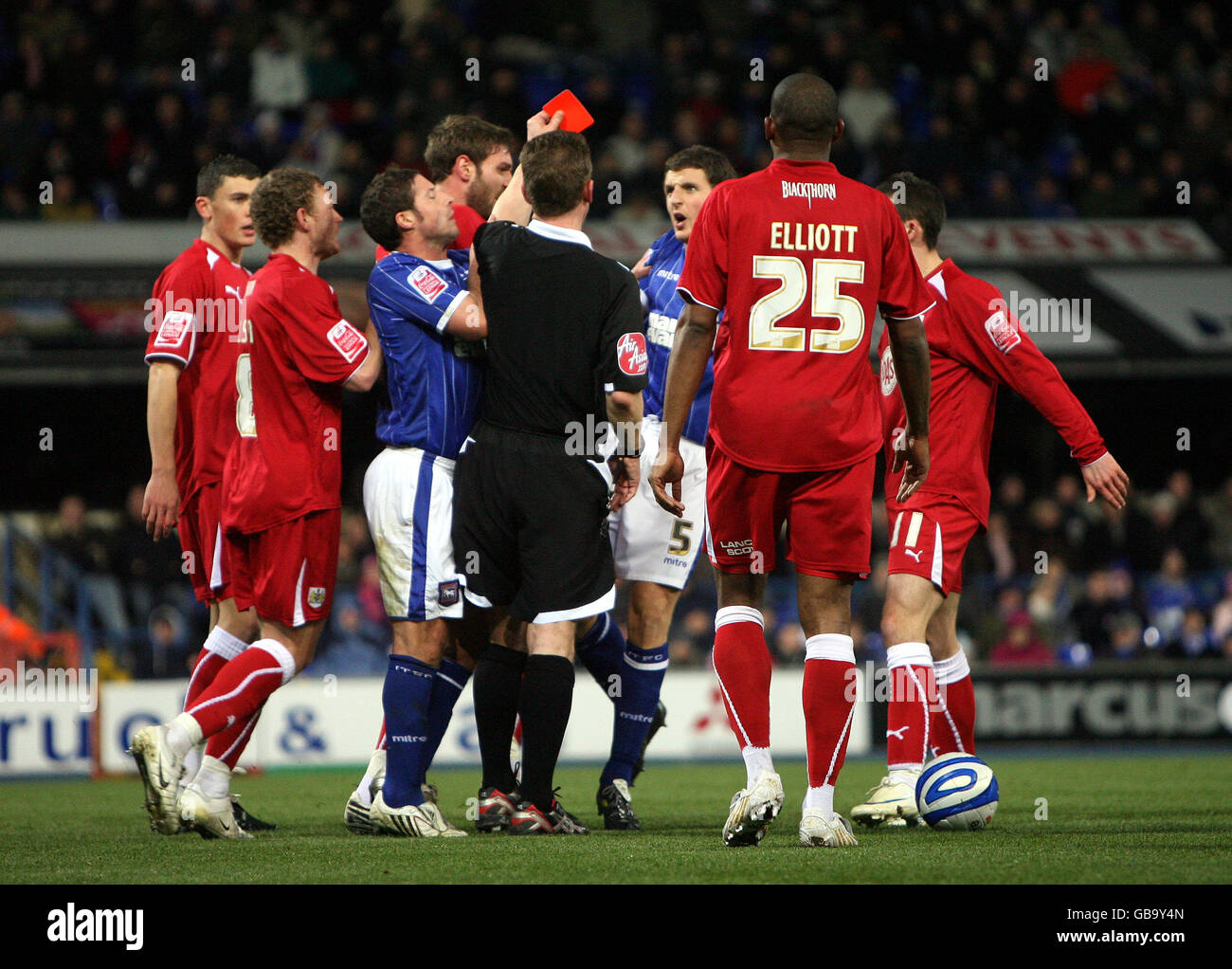 Ipswich Town's Alex Bruce (no5) is sent off for a two footed challenge ...