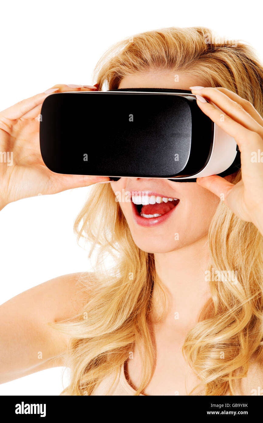 Happy woman wearing virtual reality goggles Stock Photo - Alamy