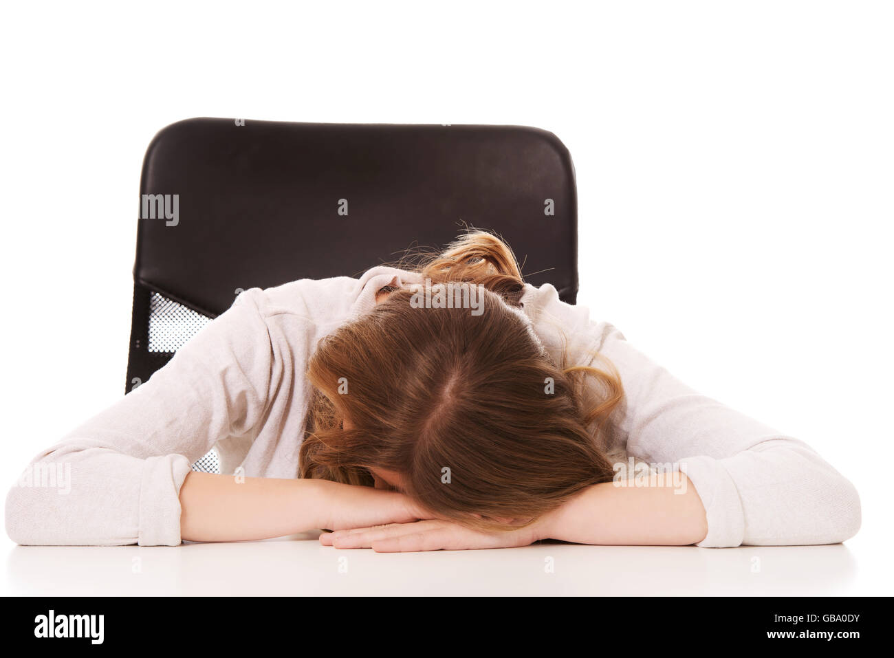 Young worried woman sleeping at the desk Stock Photo - Alamy