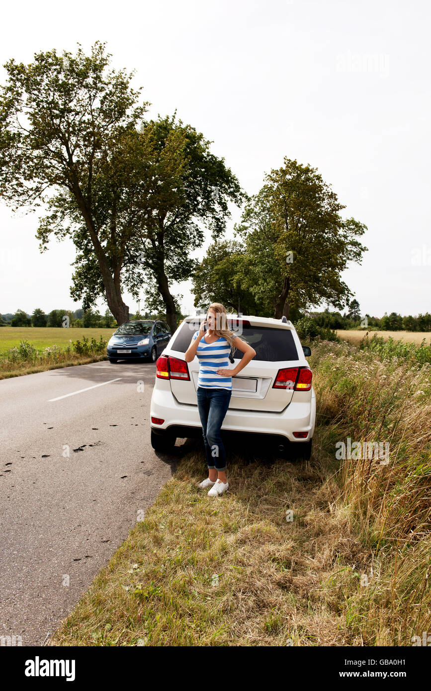 Young woman calling for help Stock Photo - Alamy