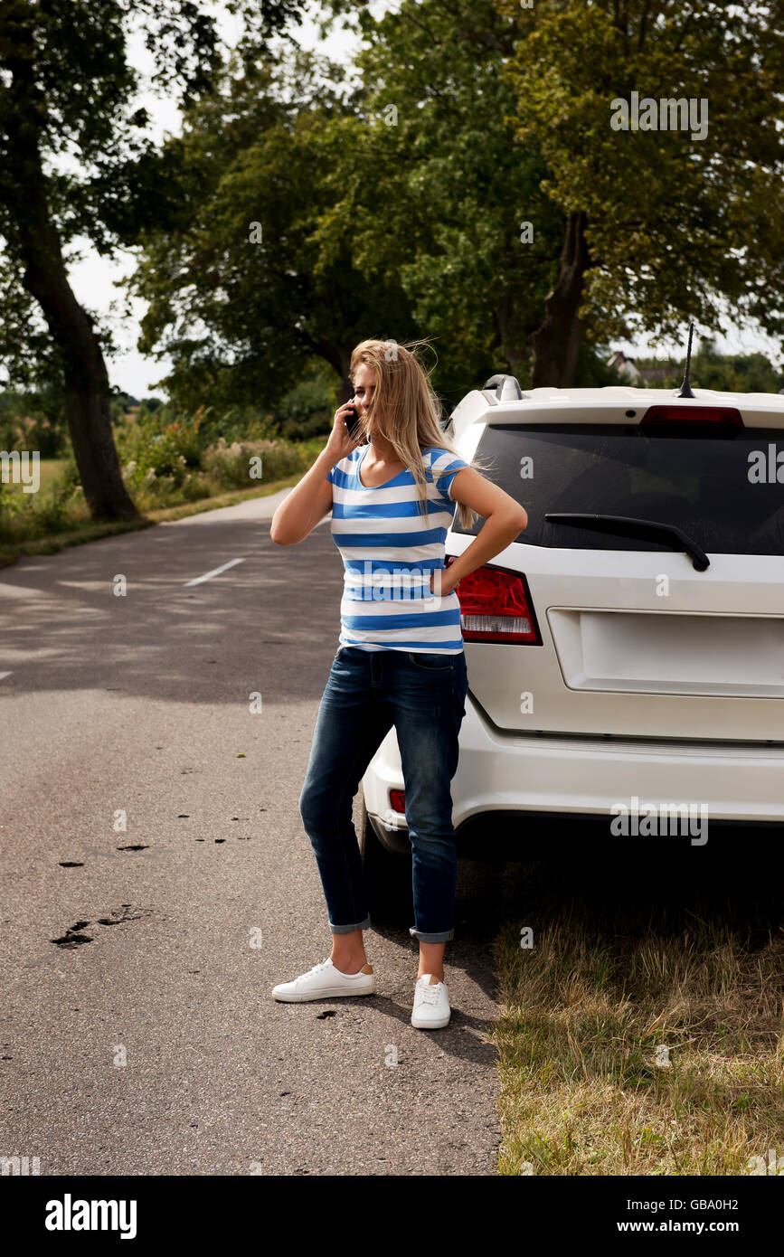 Young woman calling for help Stock Photo - Alamy