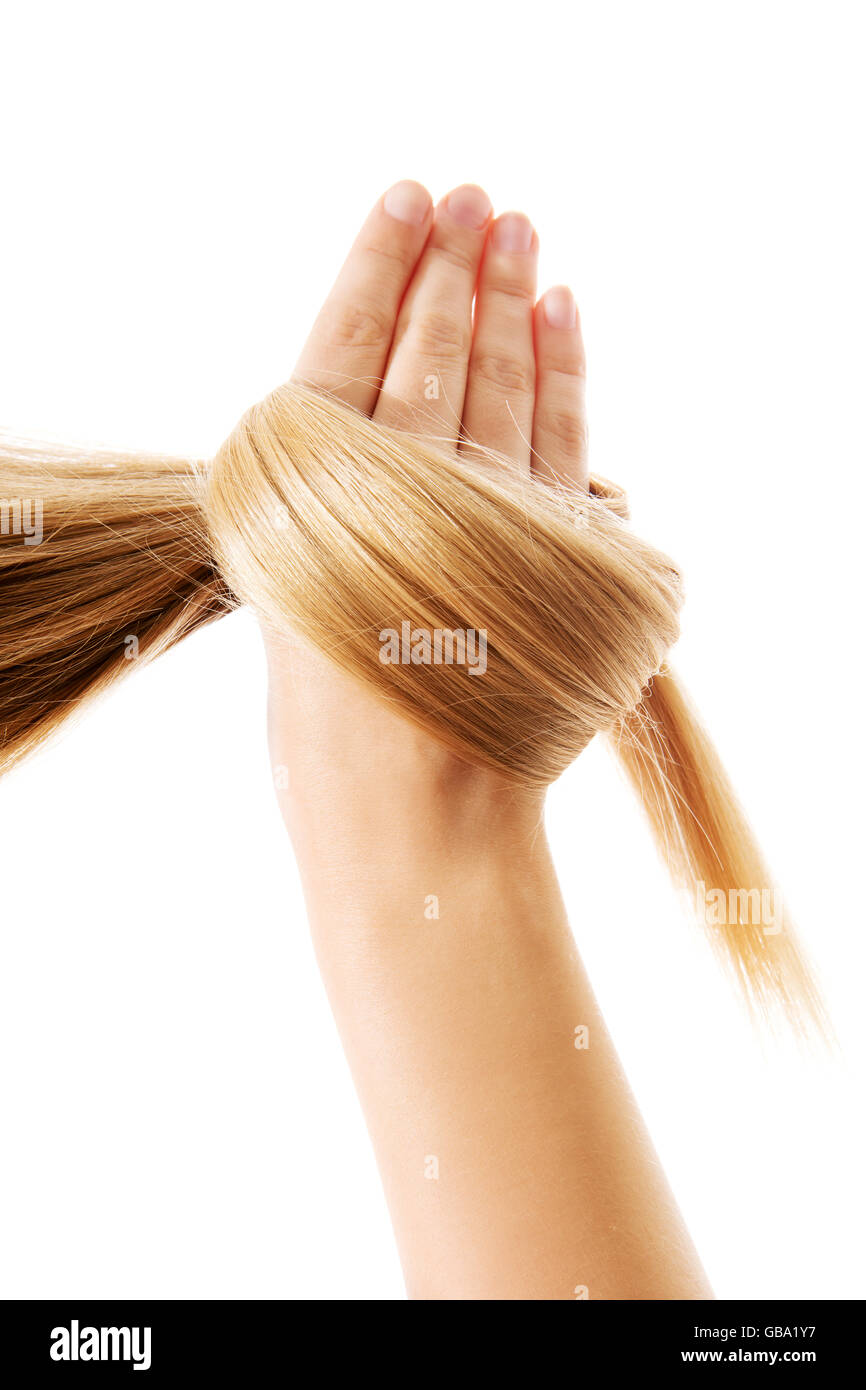 Hand holding hair. Isolated on white Stock Photo - Alamy