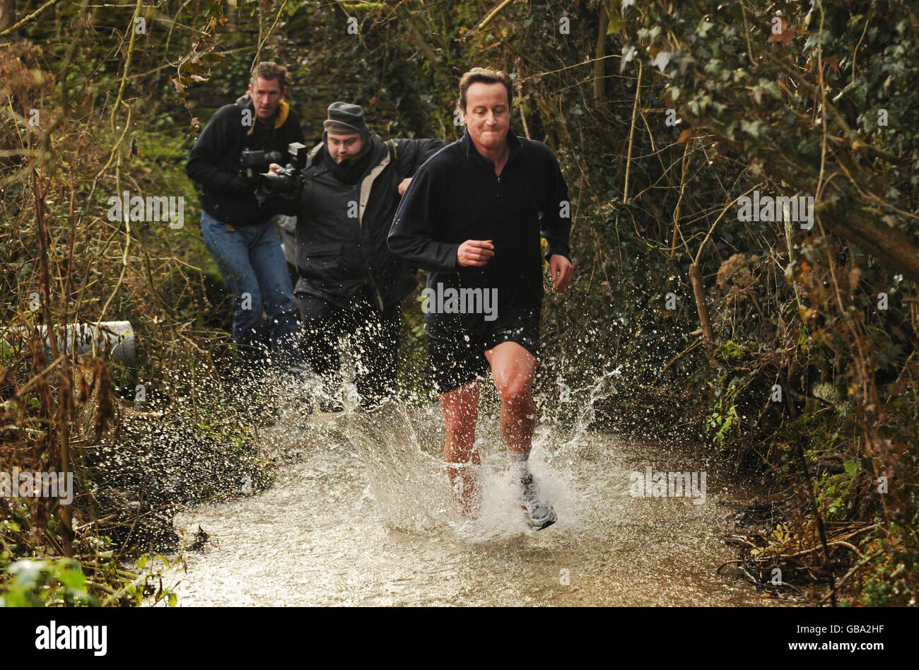 Conservative leader David Cameron emerges from crawling through a ...
