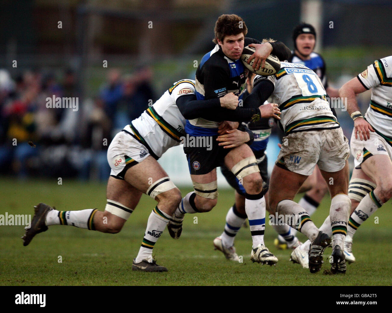 Bath's Michael Lipman runs into the tackle of Northampton's Roger ...