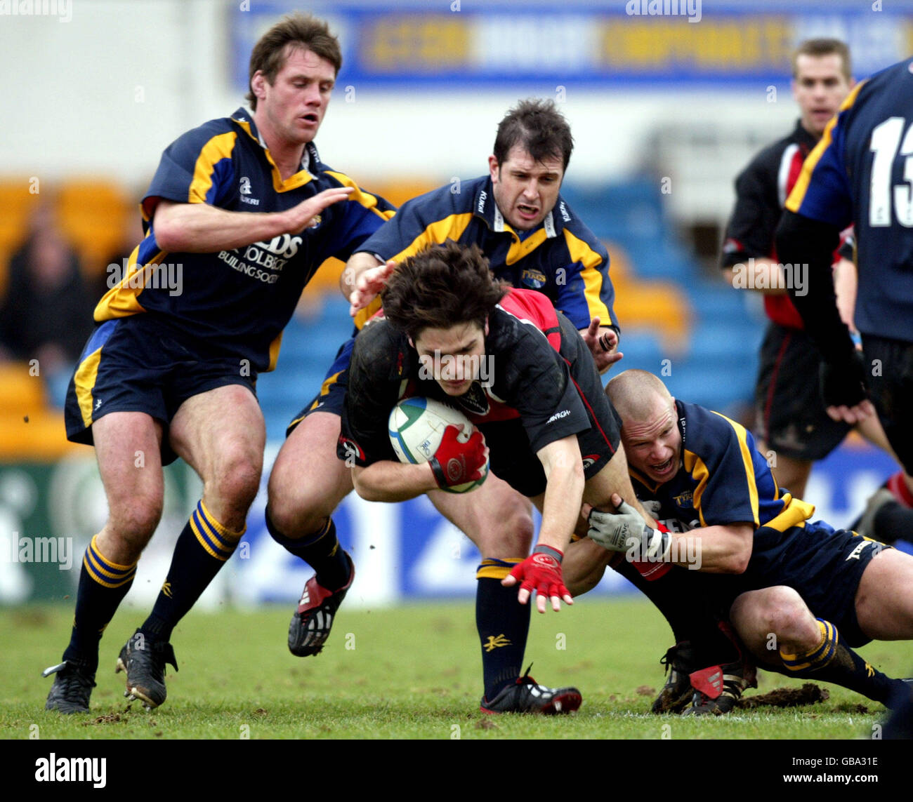 Leeds Tykes' players tackle Edinburgh's Marcus Di Rollo Stock Photo - Alamy
