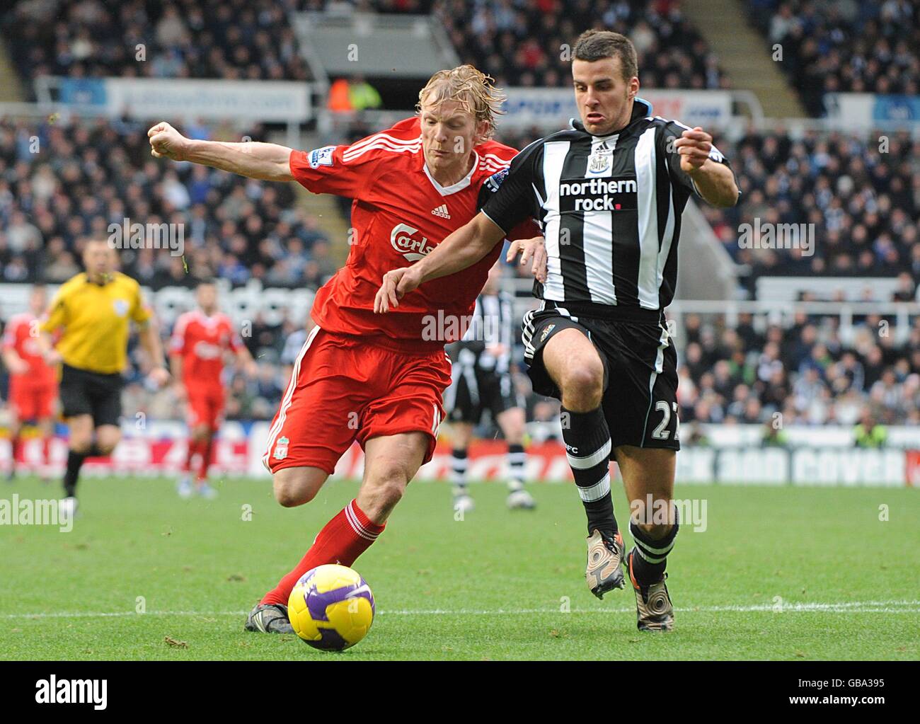 Newcastle United's Steven Taylor and Liverpool's Dirk Kuyt (left ...