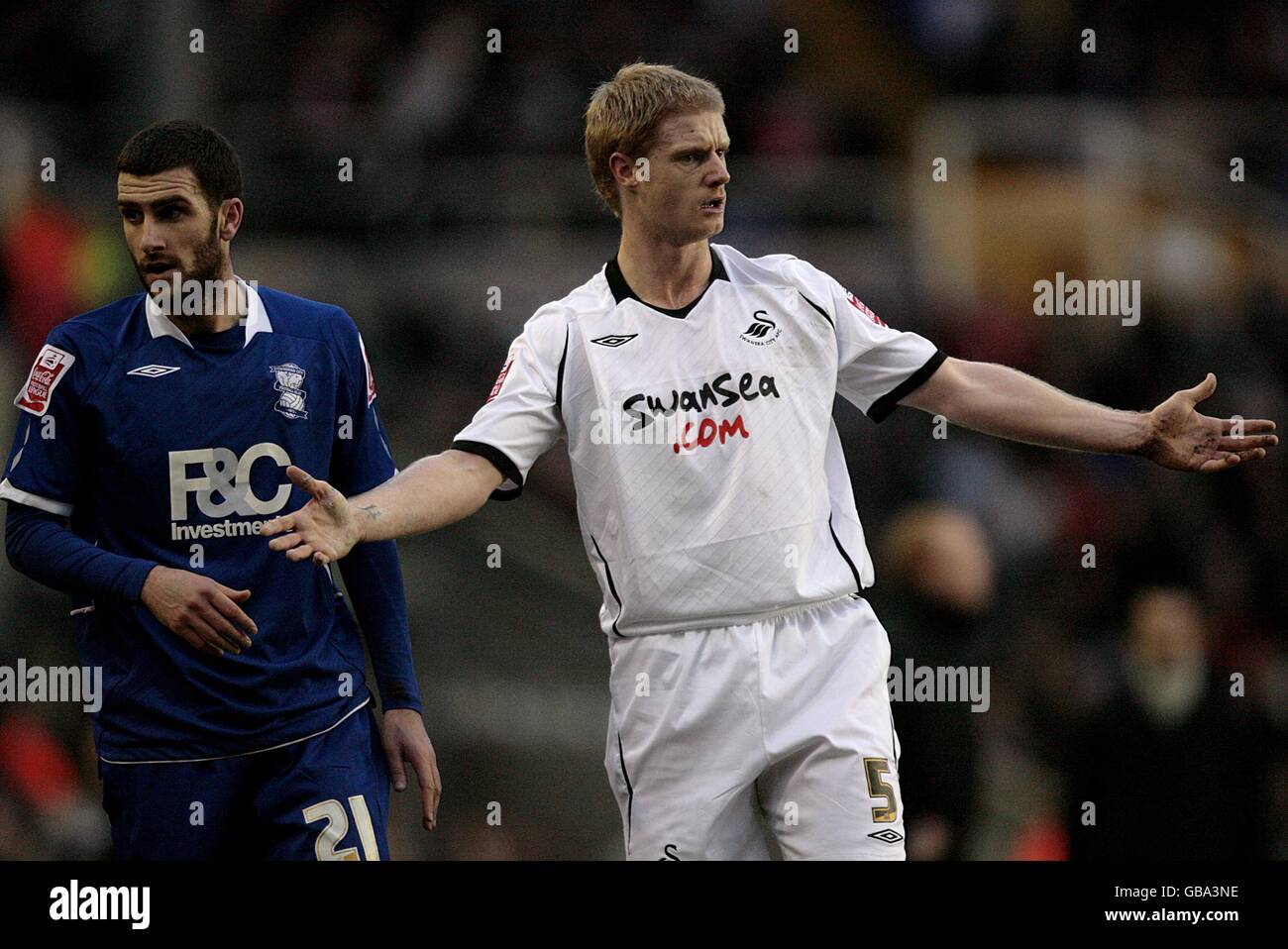 Birmingham citys stuart parnaby left and swansea citys alan tate hi-res ...