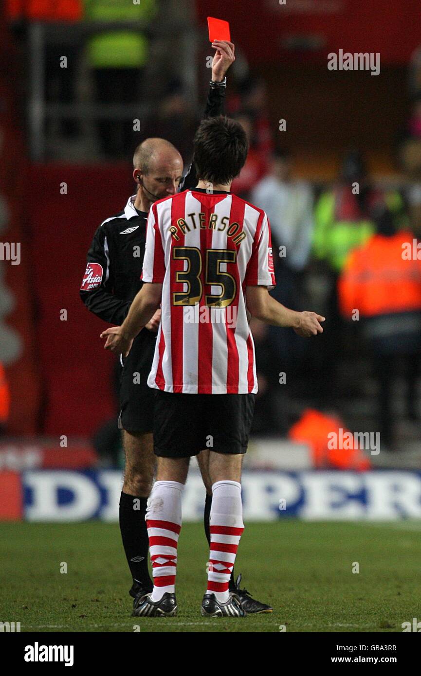 Southampton's Matthew Paterson is shown a red card by referee Mike ...