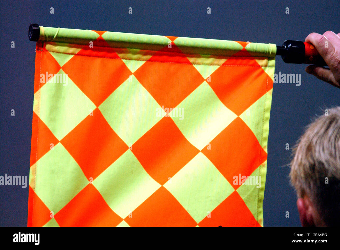 The assistant referee holds up his flag hi-res stock photography and ...