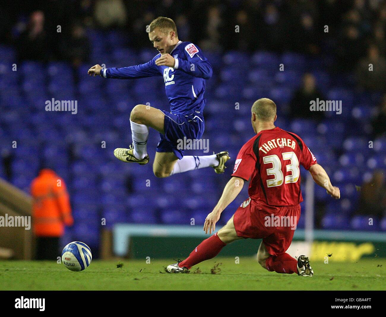 Birmingham City's Sebastian Larsson jumps clear of a challenge from ...