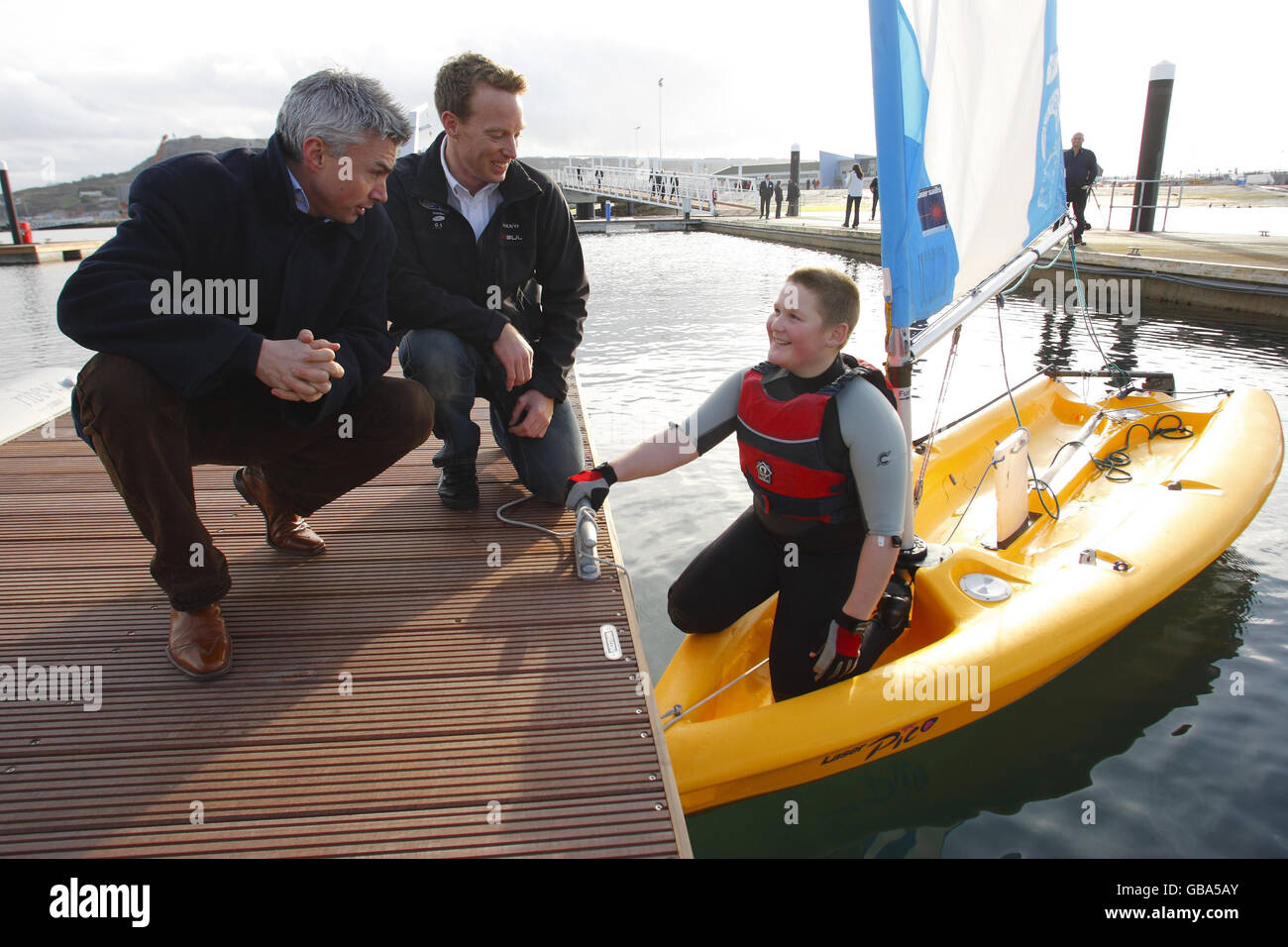 Beijing Gold medal-winning British sailor Paul Goodison (centre) and ...