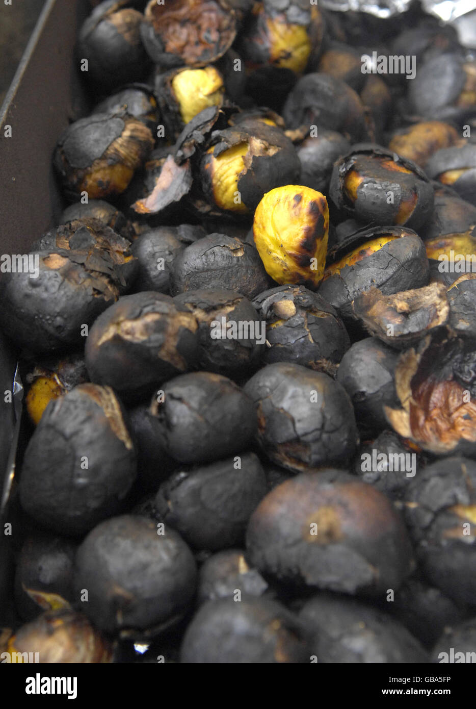 Chestnuts being roasted by a vendor on Oxford Street in London Stock ...